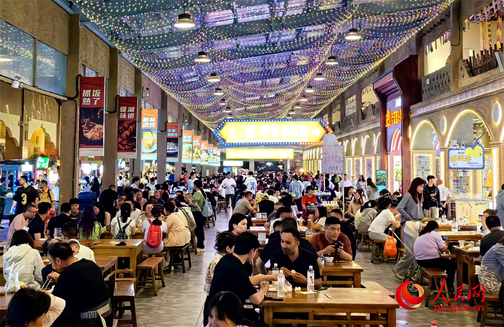 A glimpse of vibrant nightlight at international grand bazaar in Xinjiang